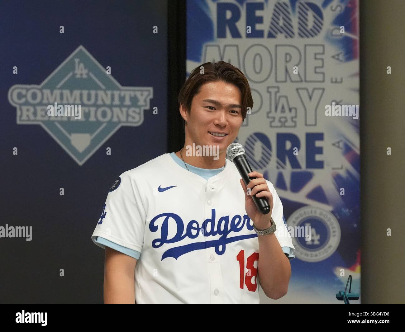 Los Angeles Dodgers pitcher Yoshinobu Yamamoto smiles as he takes ...