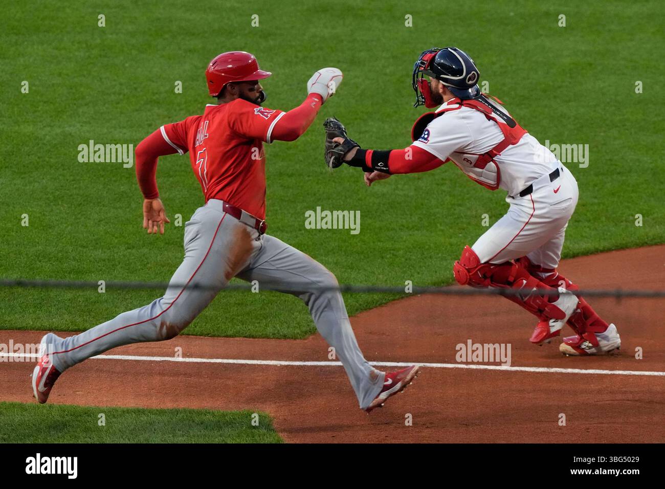 Los Angeles Angels' Jo Adell beats a throw to Boston Red Sox catcher ...
