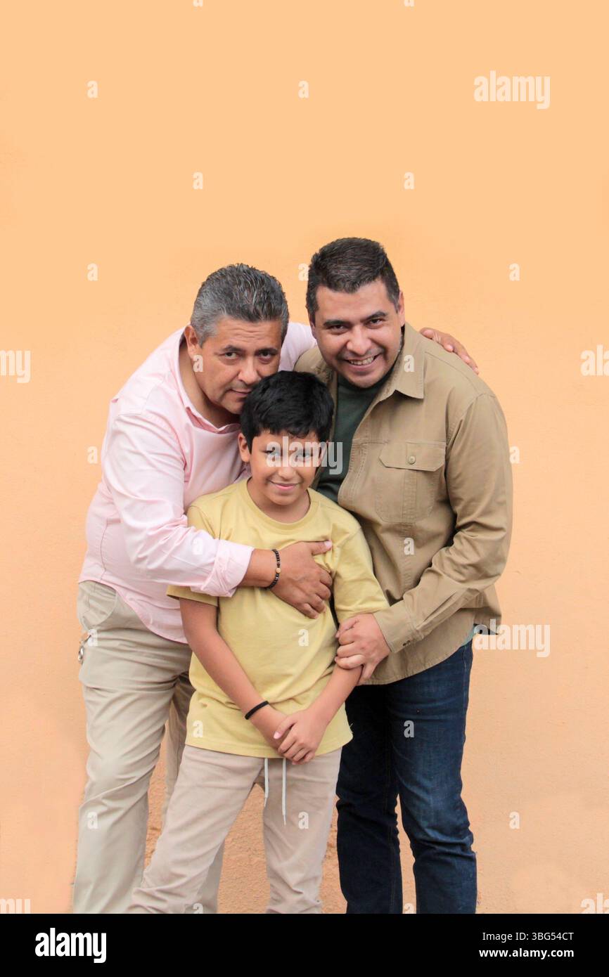 Three generations of a dark-skinned Latino grandfather, father, and son ...