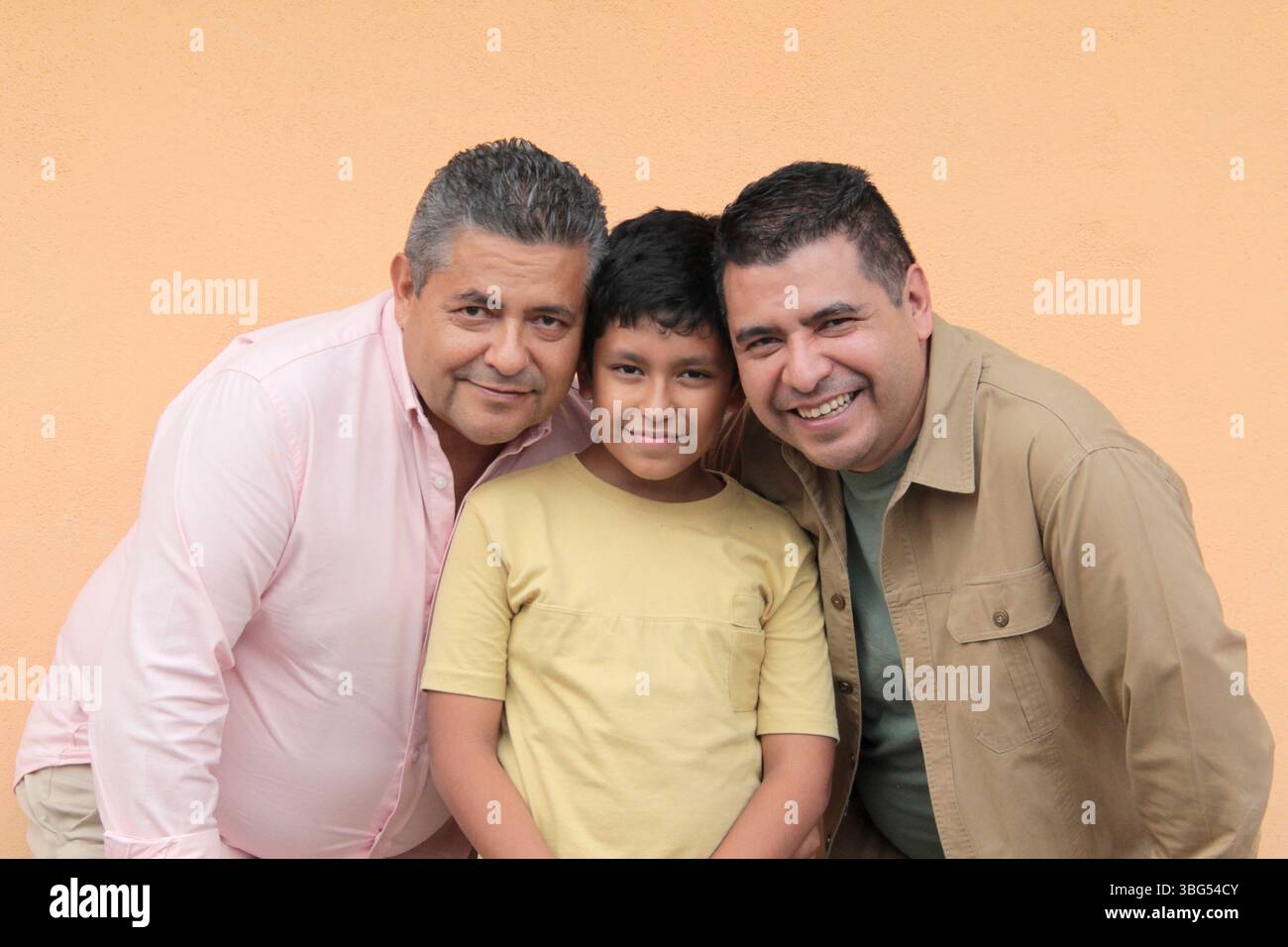 Three generations of a dark-skinned Latino grandfather, father, and son ...