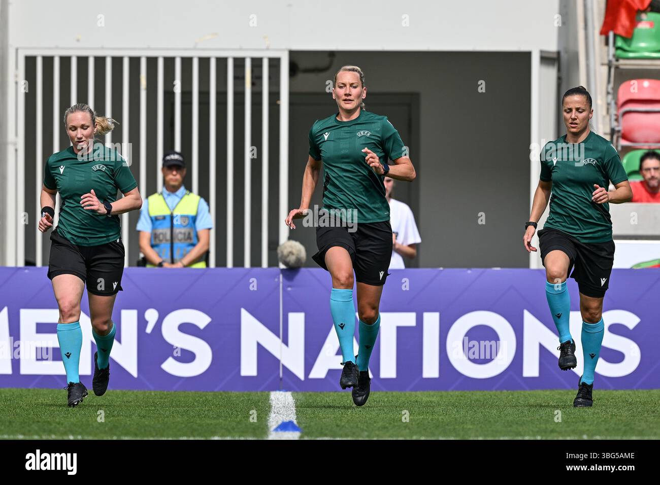 Warming-up referees ( assistant referee Monica Lokkeberg , referee Tess ...
