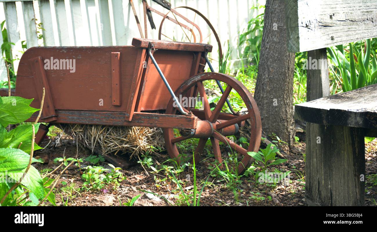 Antique Homemade Wheelbarrow in Garden Stock Photo - Alamy