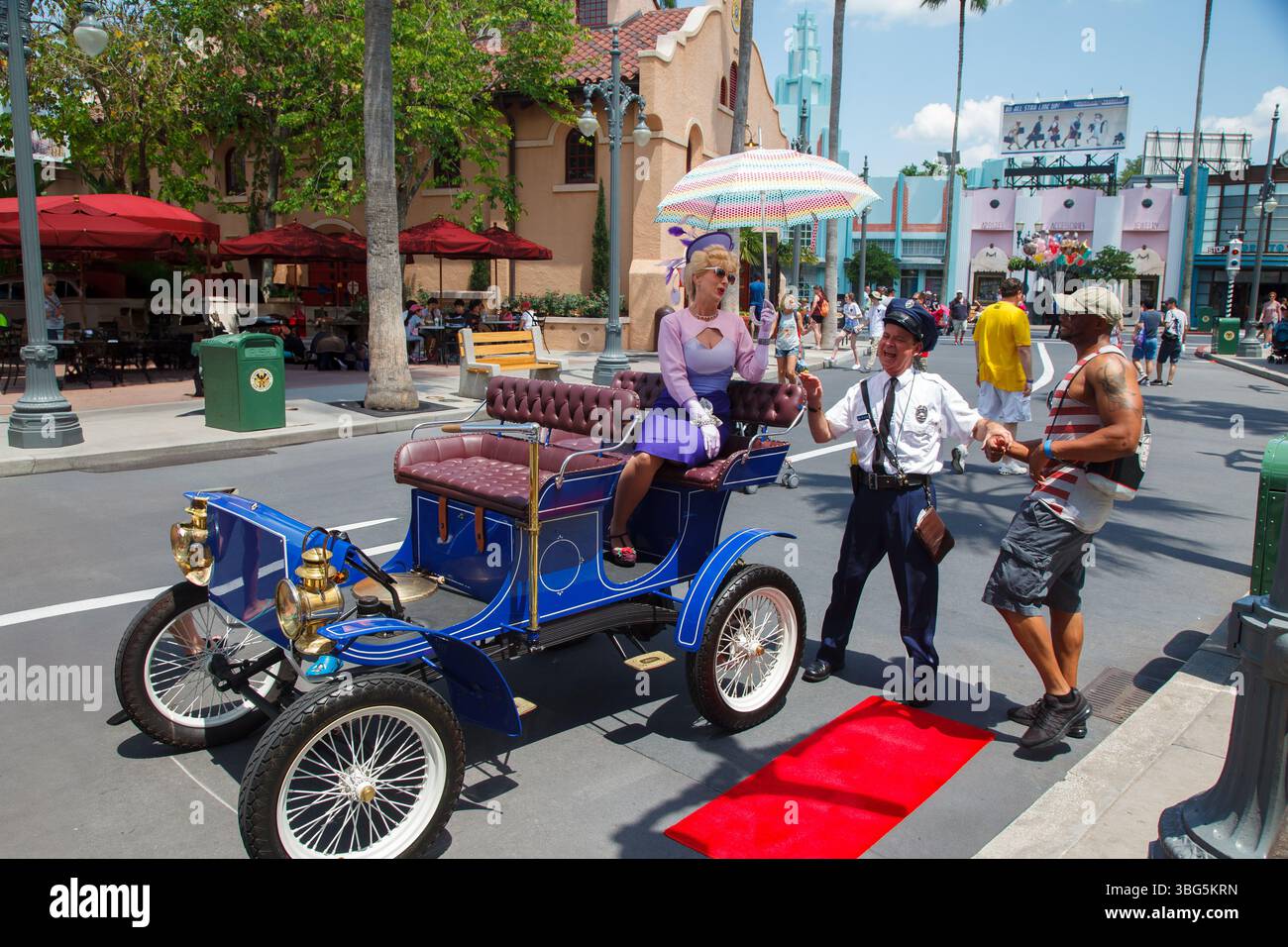 A Vintage car, lady with umbrella and police officer retro style in ...