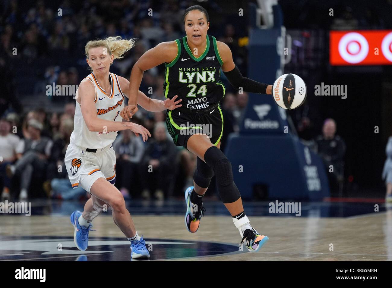 Minnesota Lynx forward Napheesa Collier (24) dribbles down the court as ...