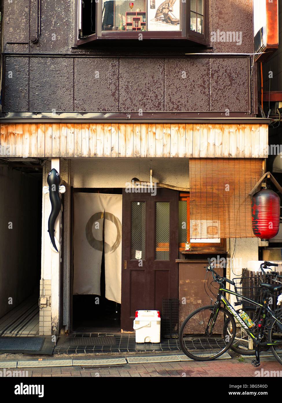 Traditional Japanese unagi restaurant with lantern and noren curtain in ...