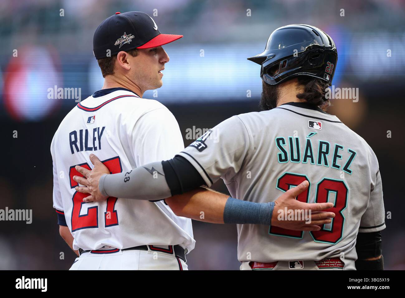 Atlanta Braves third baseman Austin Riley, left, embraces Arizona ...
