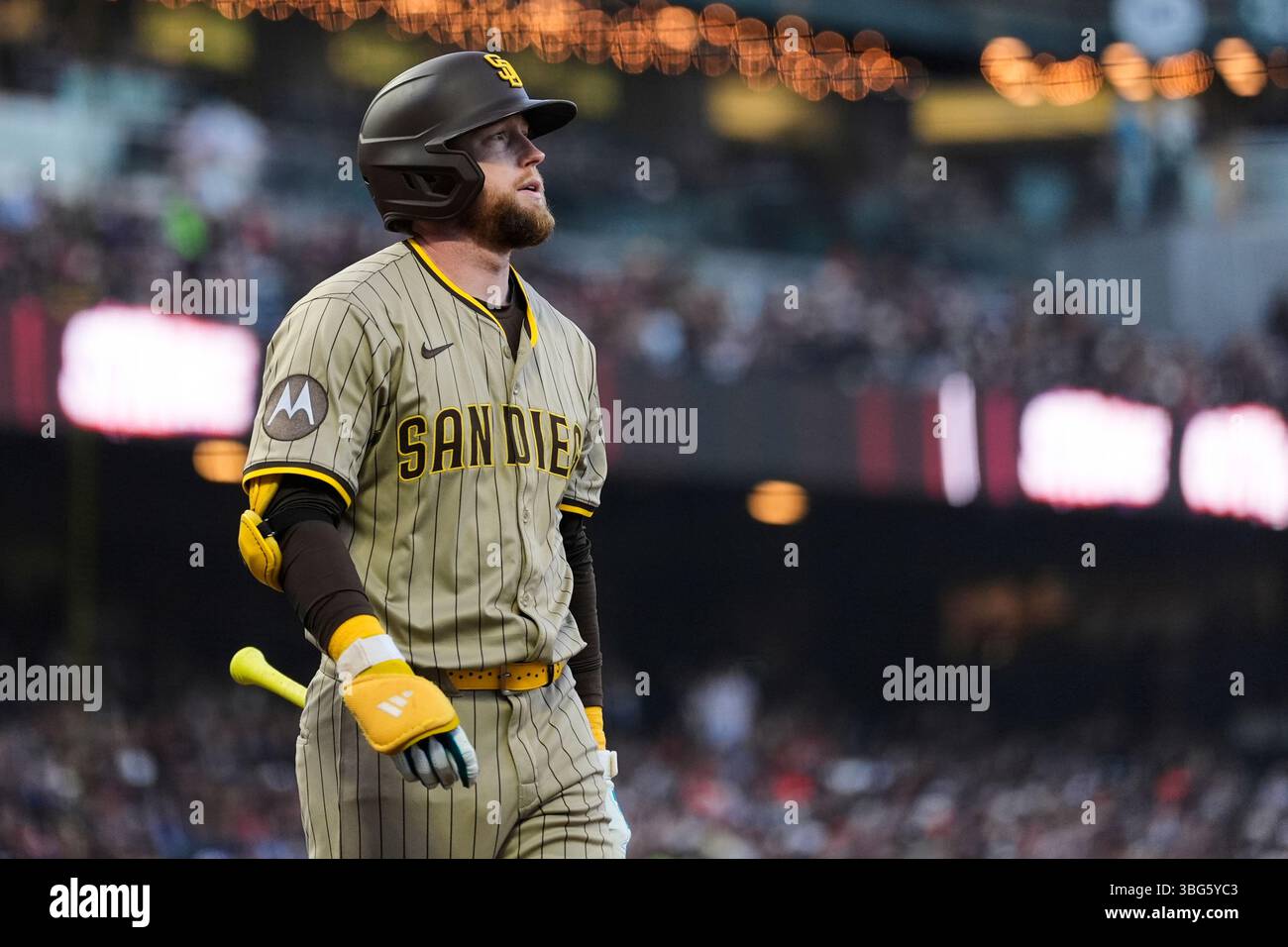San Diego Padres' Jake Cronenworth walks to the dugout after striking ...