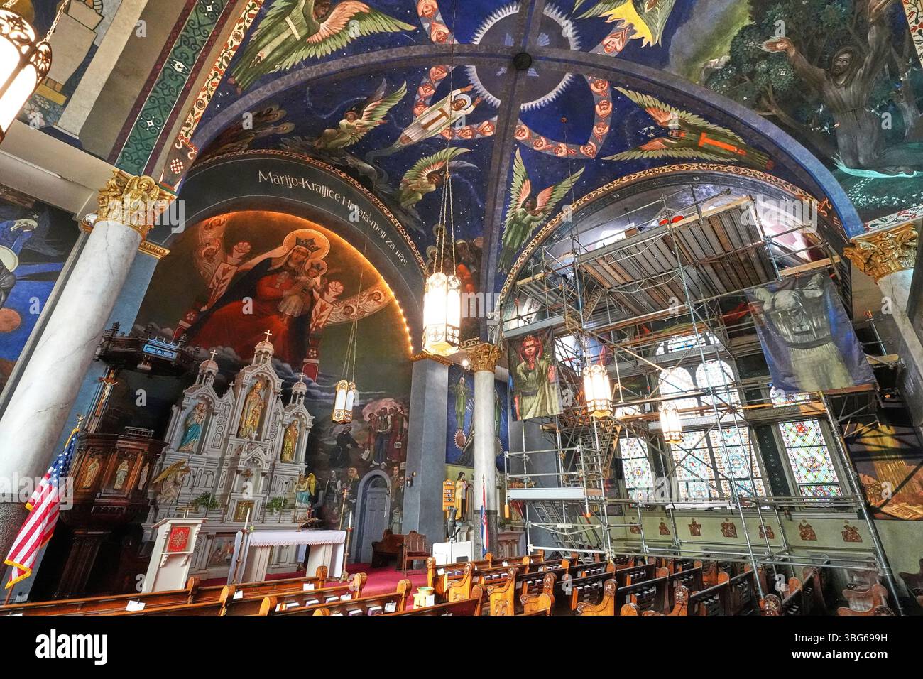 A 32-foot-high scaffold allows art conservation workers close up access ...