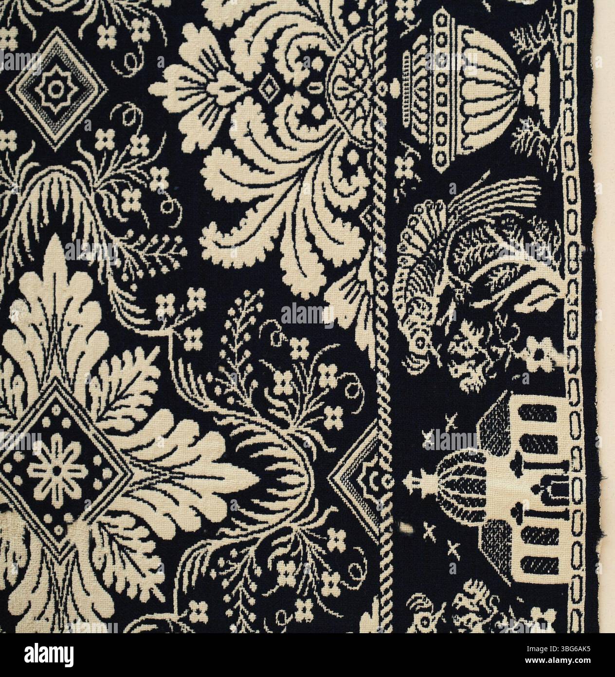 The Craig coverlet, a double Jacquard weaving, features dark blue and ...