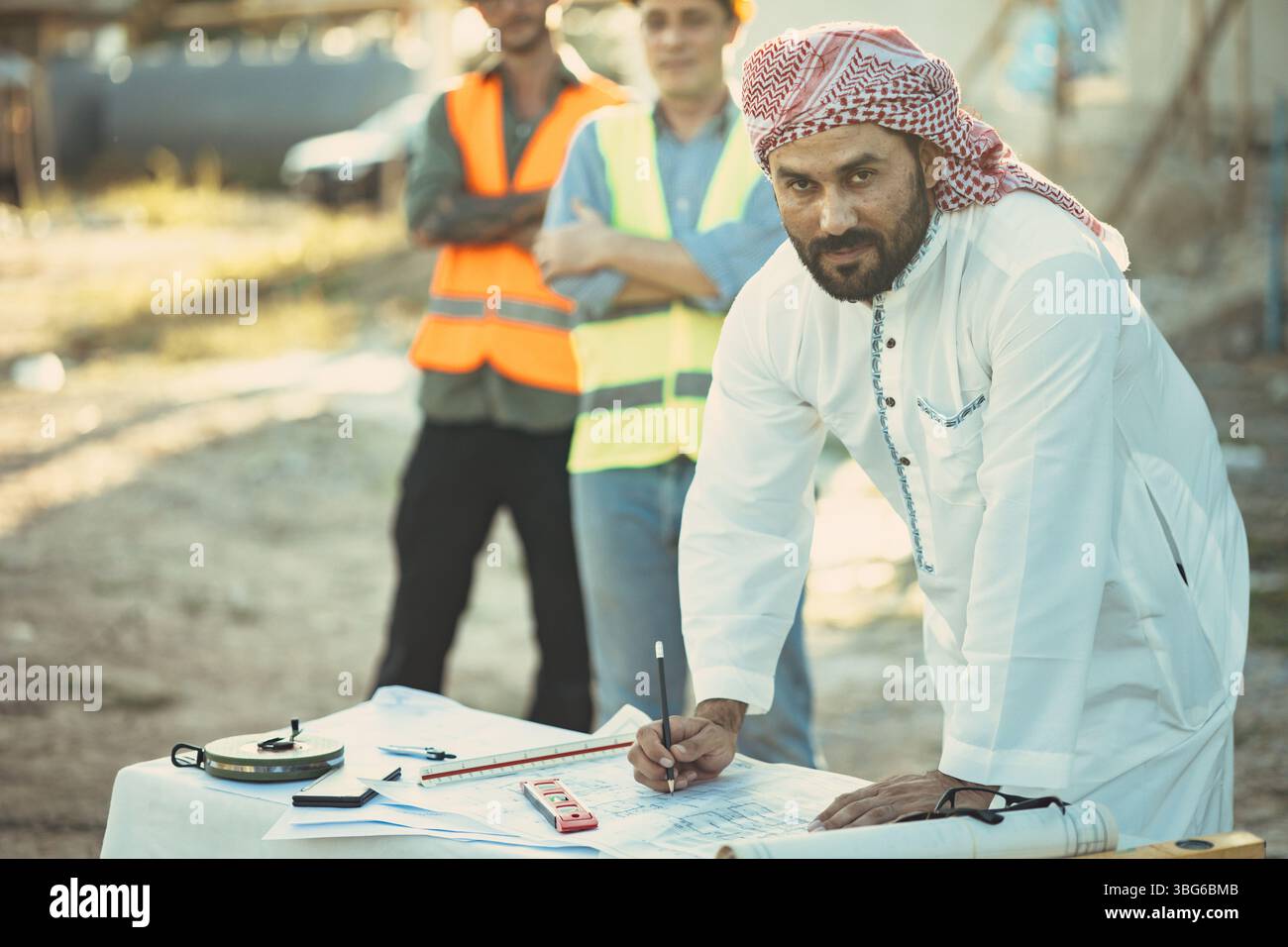 Arab construction engineer architect, Muslim builder working outdoor at ...