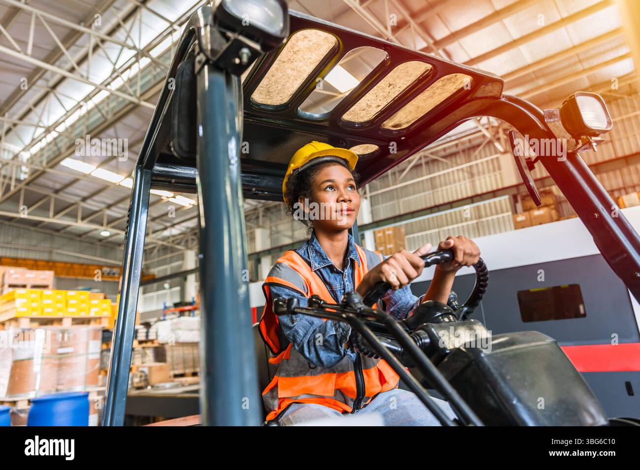 warehouse worker forklift driver happy smiling enjoy staff working. african black women factory ...