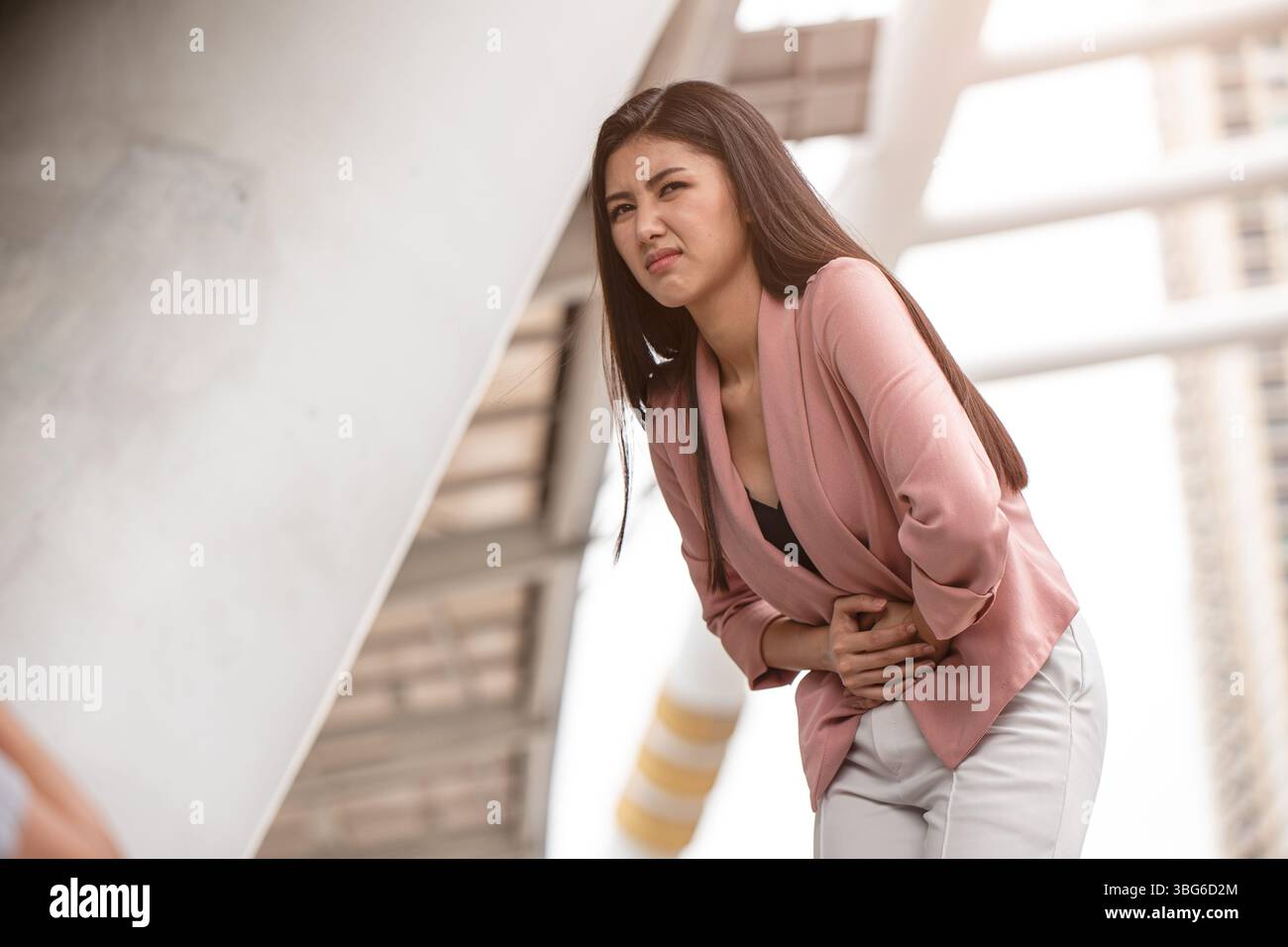 Office woman sick holding belly with menstrual pain, stomach cramping, abdomen hurt ache ...