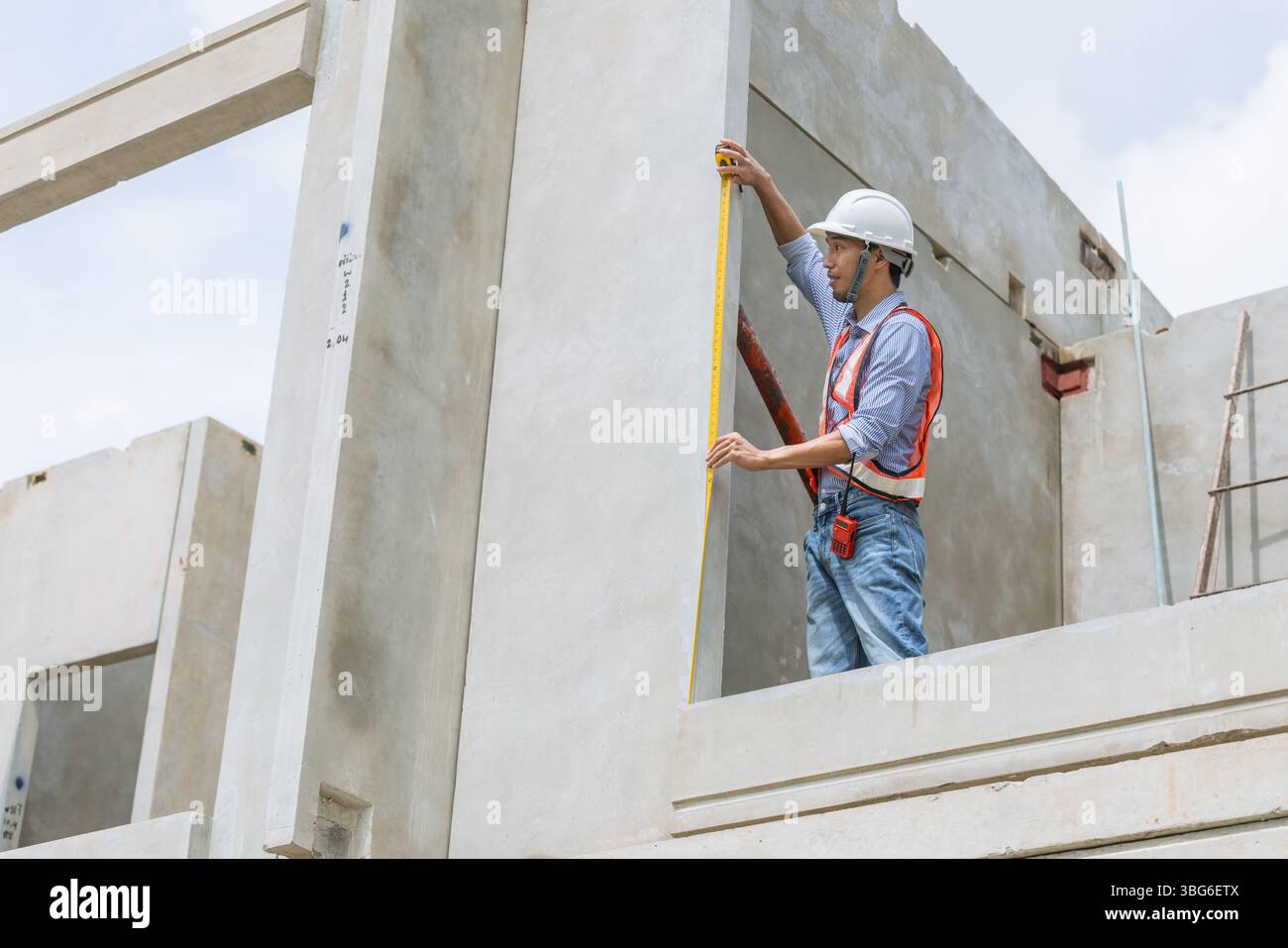 Home builder worker using tape measurement working in house building ...