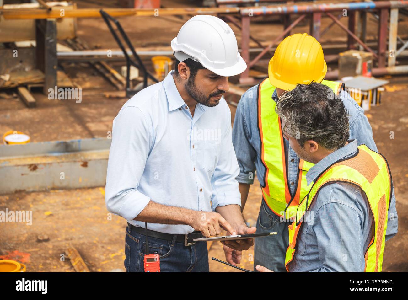 Construction engineer team working together join teamwork talking together at construction site ...