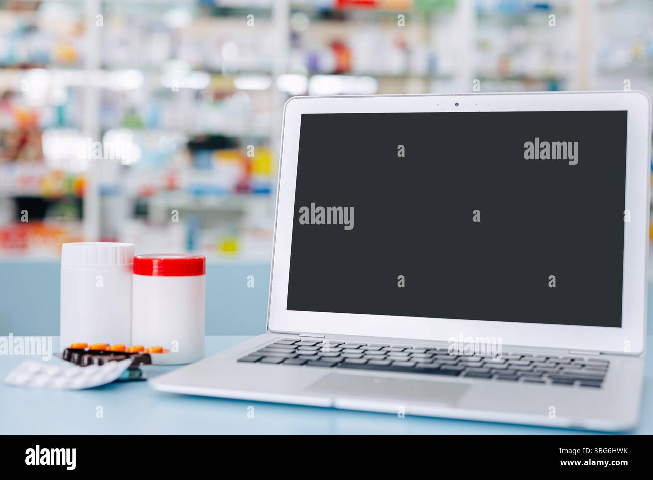 Computer laptop keyboard blank screen set on drugstore counter table ...