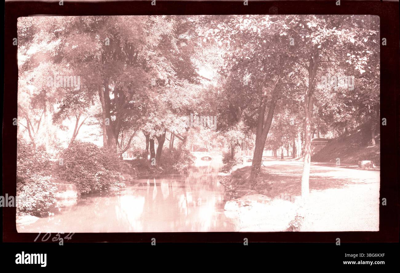 A canal flows under a stone bridge at Prospect Point Park in New York ...