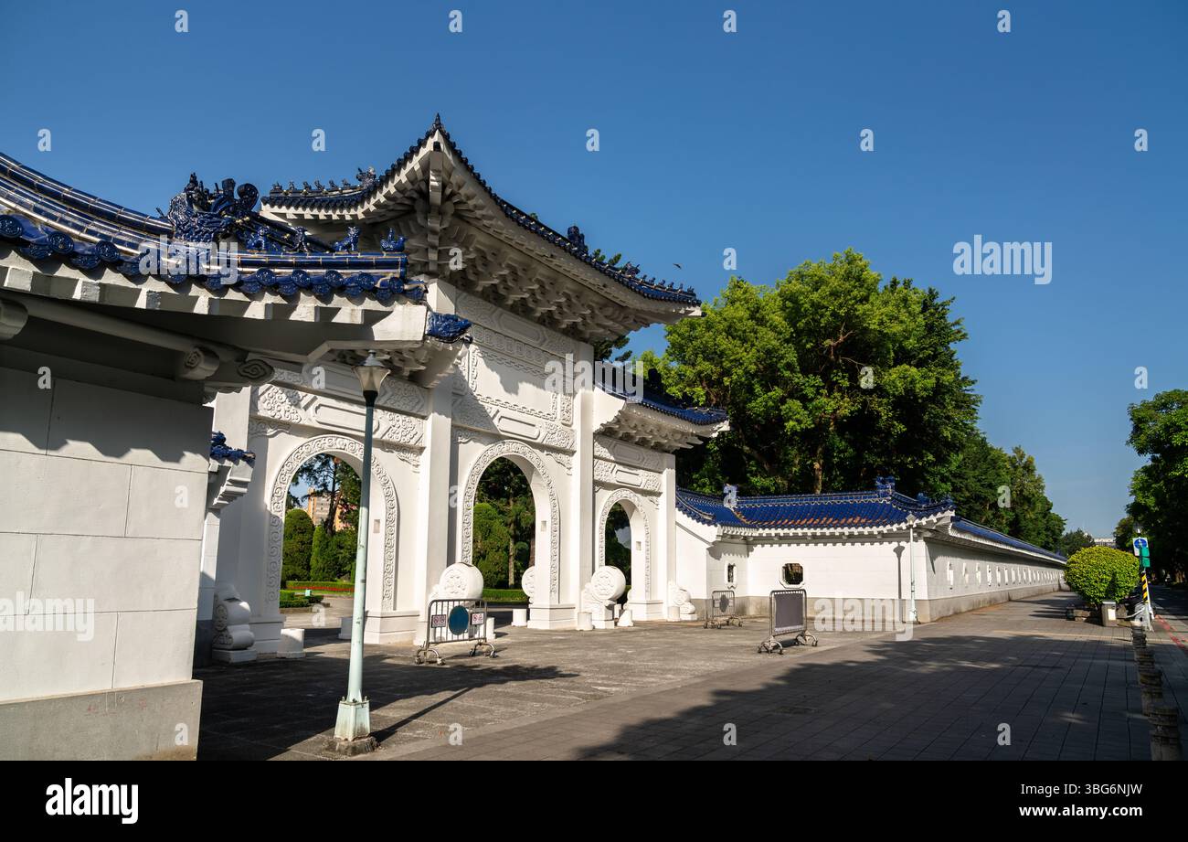 Crisp morning view in Taipei, Taiwan, shows a triple-arched white gate ...