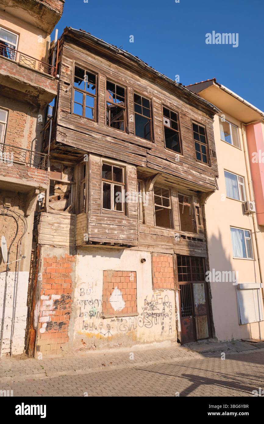 Exterior view of an old, classic, generic wood house, falling down and ...