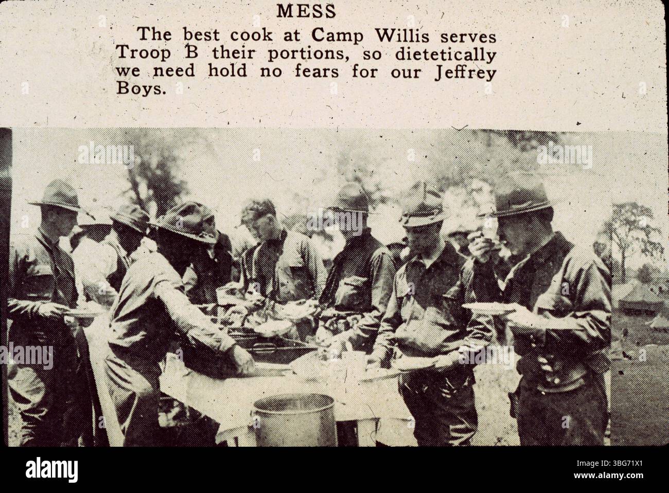 Photograph from 1916 showing a cook at Camp Willis serving soldiers of ...