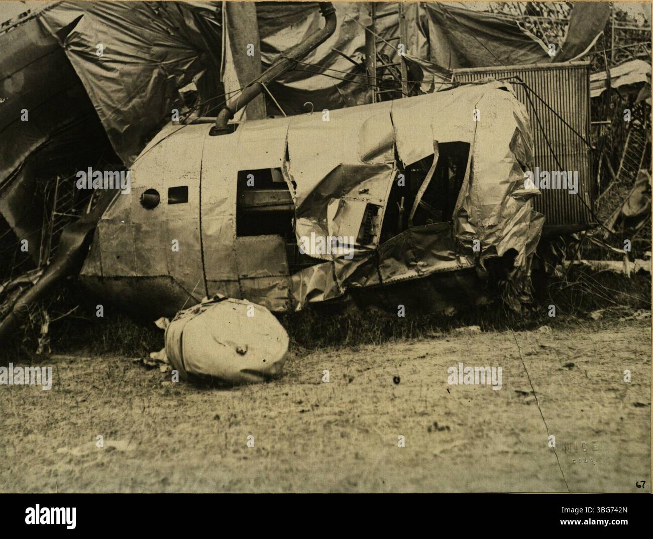 A photograph of the wreck of the government dirigible Shenandoah, which ...