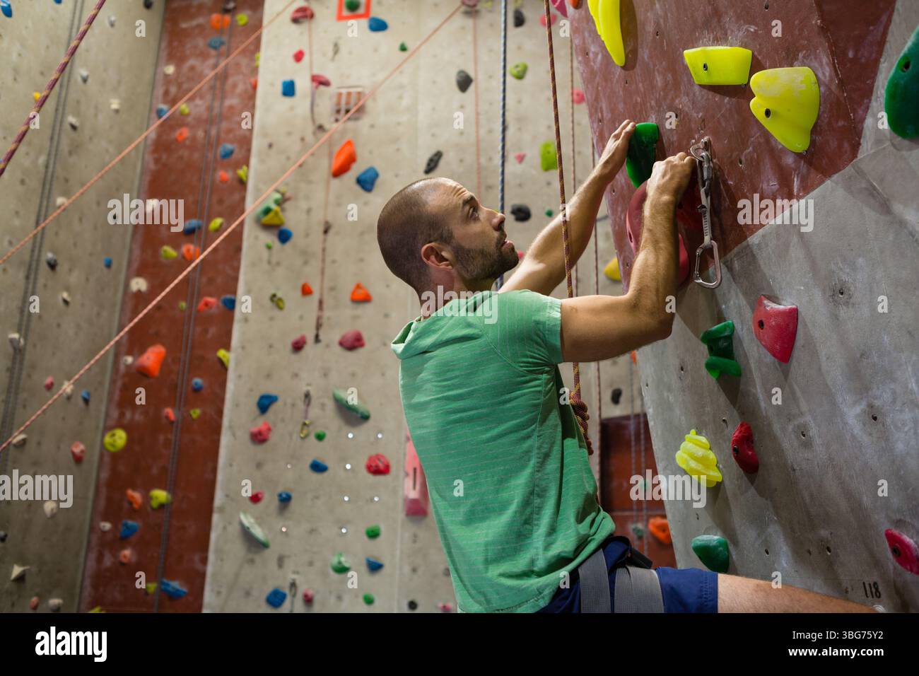Male climber gripping holds hi-res stock photography and images - Alamy