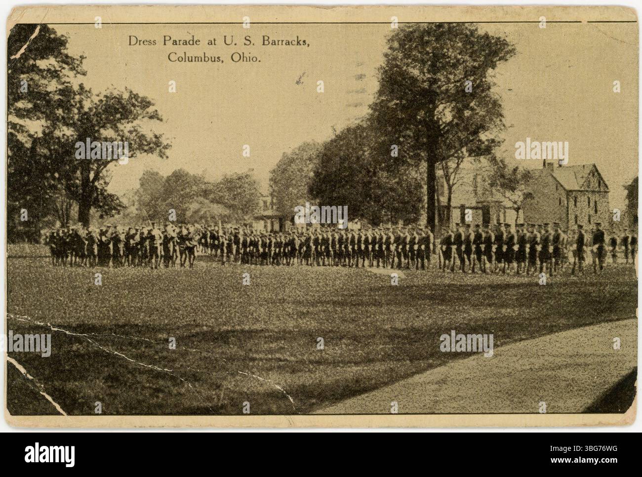 This sepia-toned postcard shows a dress parade at the US Barracks in ...