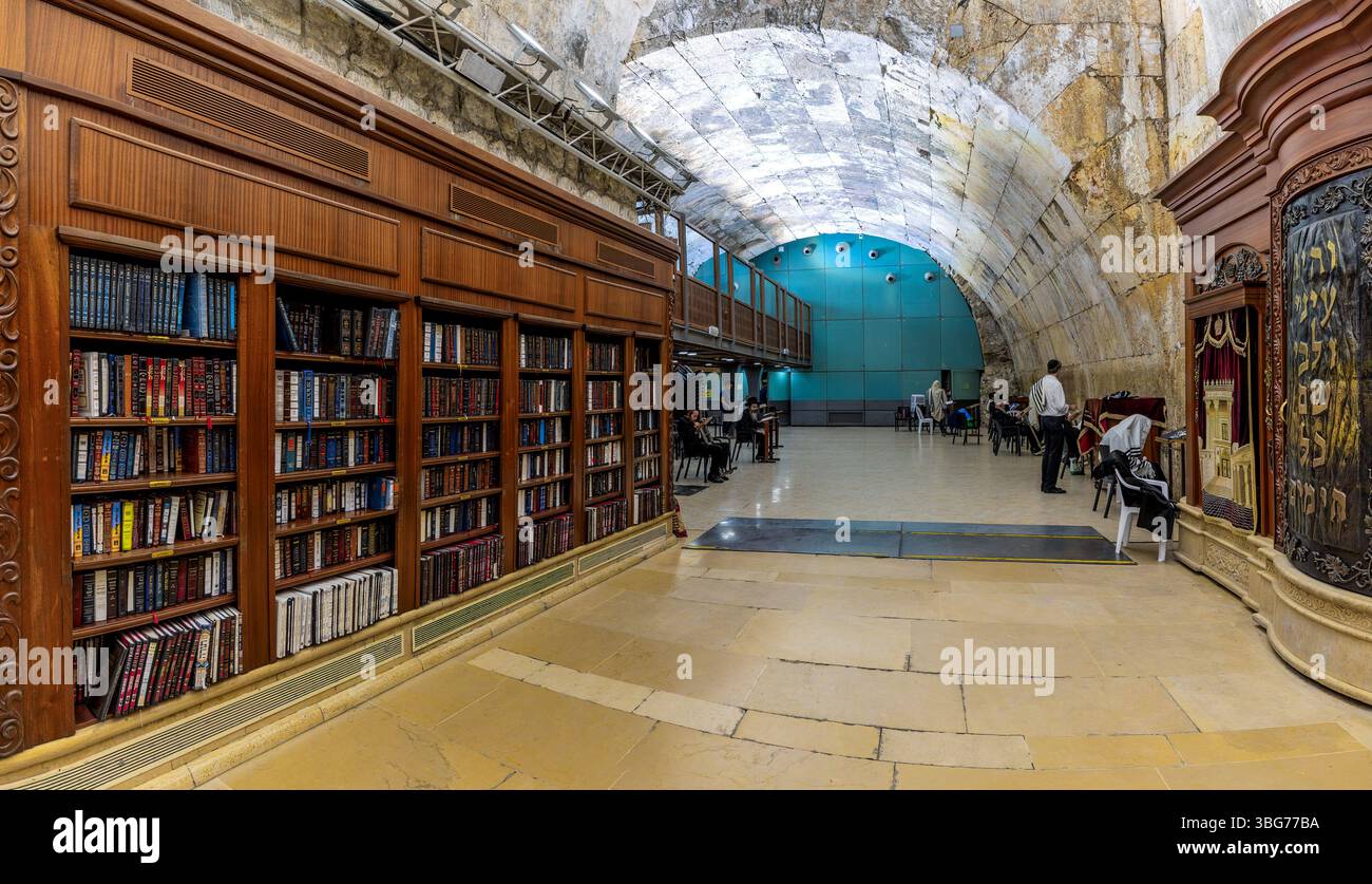 Worshippers inside the Cave Synagogue within the Western Wall tunnels ...