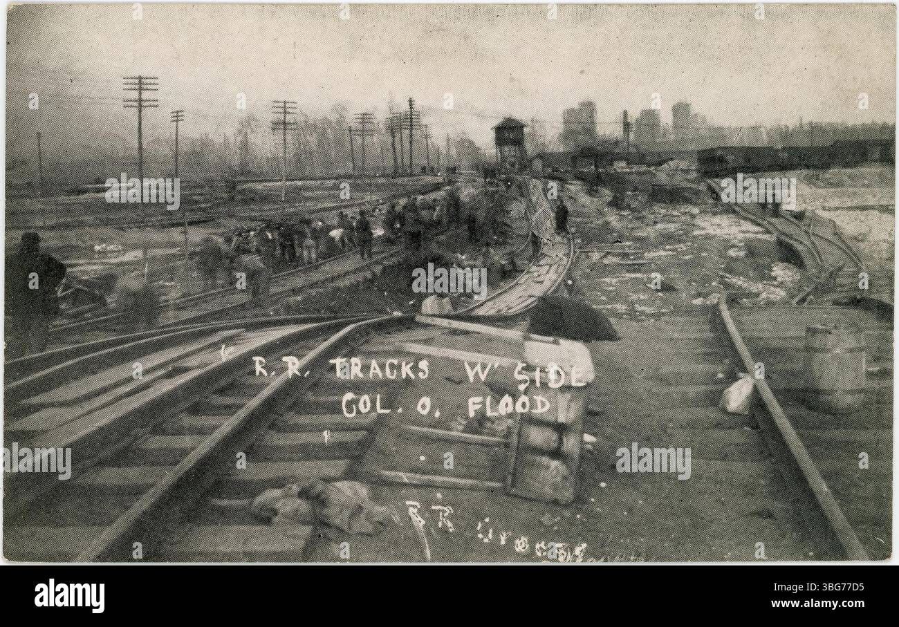 Black and white postcard showing flooded railroad tracks on the West ...