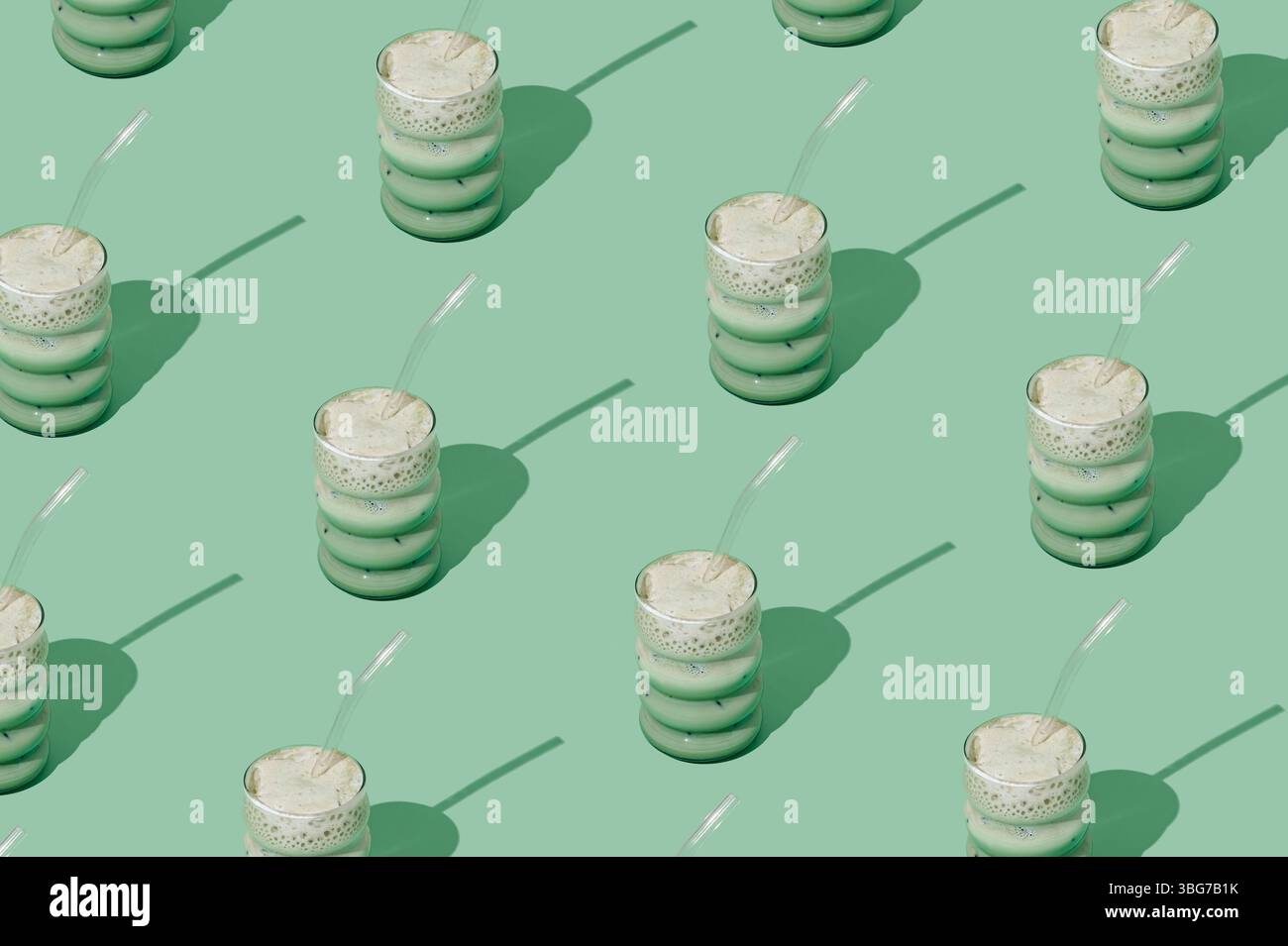 Creative summer pattern made of iced matcha latte on pastel green ...