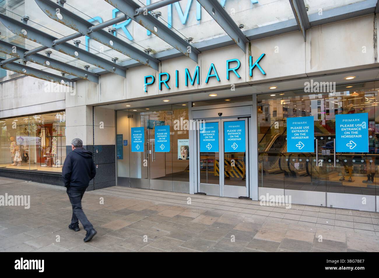 Person walking past Primark store shop in Broadmeads shopping centre ...