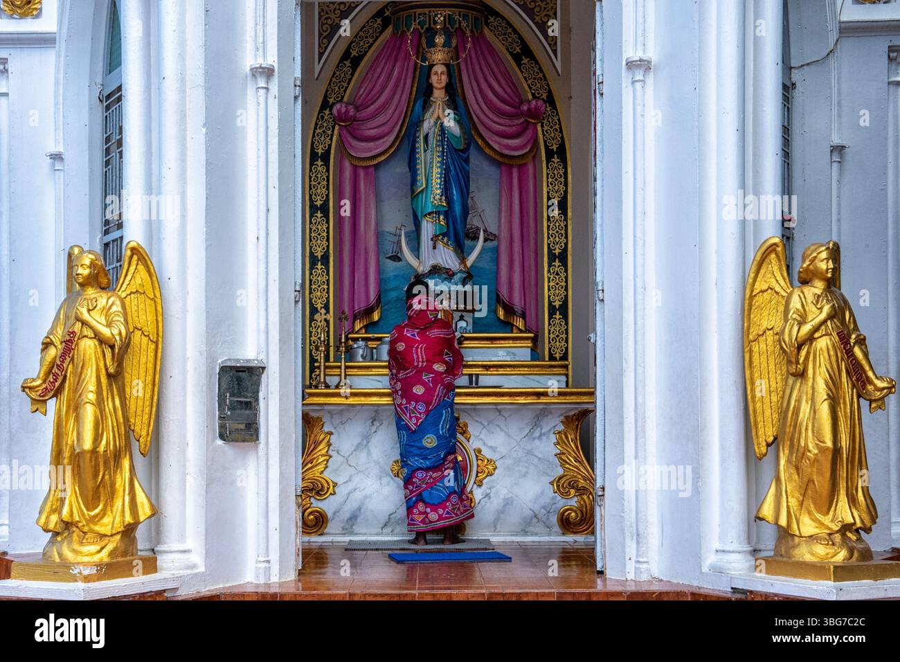 Catholic people praying near the Our Lady of Ransom Shrine Church in ...