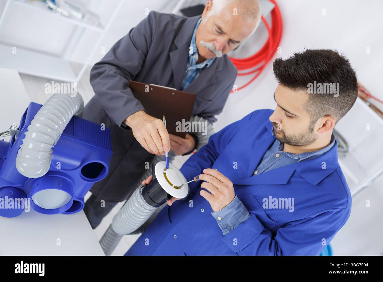 Installing red plastic pipes hi-res stock photography and images - Alamy