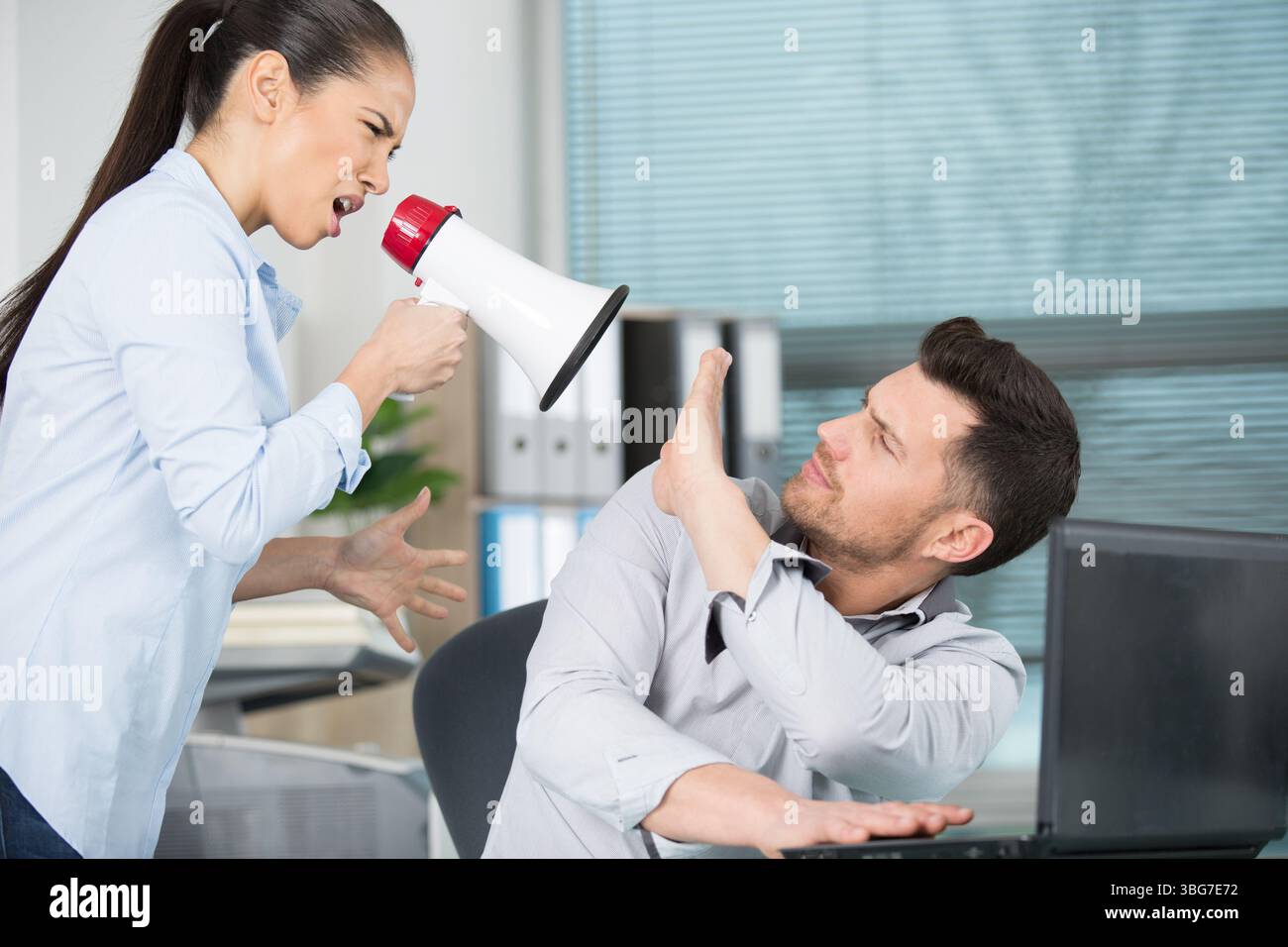 angry woman boss yelling at her male employee Stock Photo - Alamy