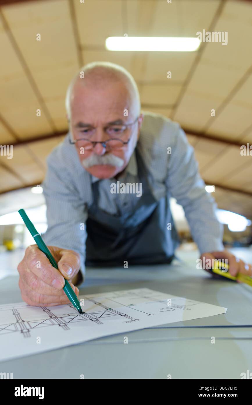 master builder making adjustments on design Stock Photo - Alamy