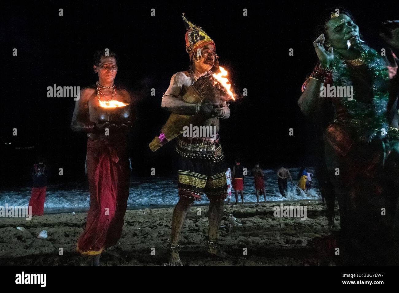 The parade ends in the beach of Kulasai village. The devotees are ...