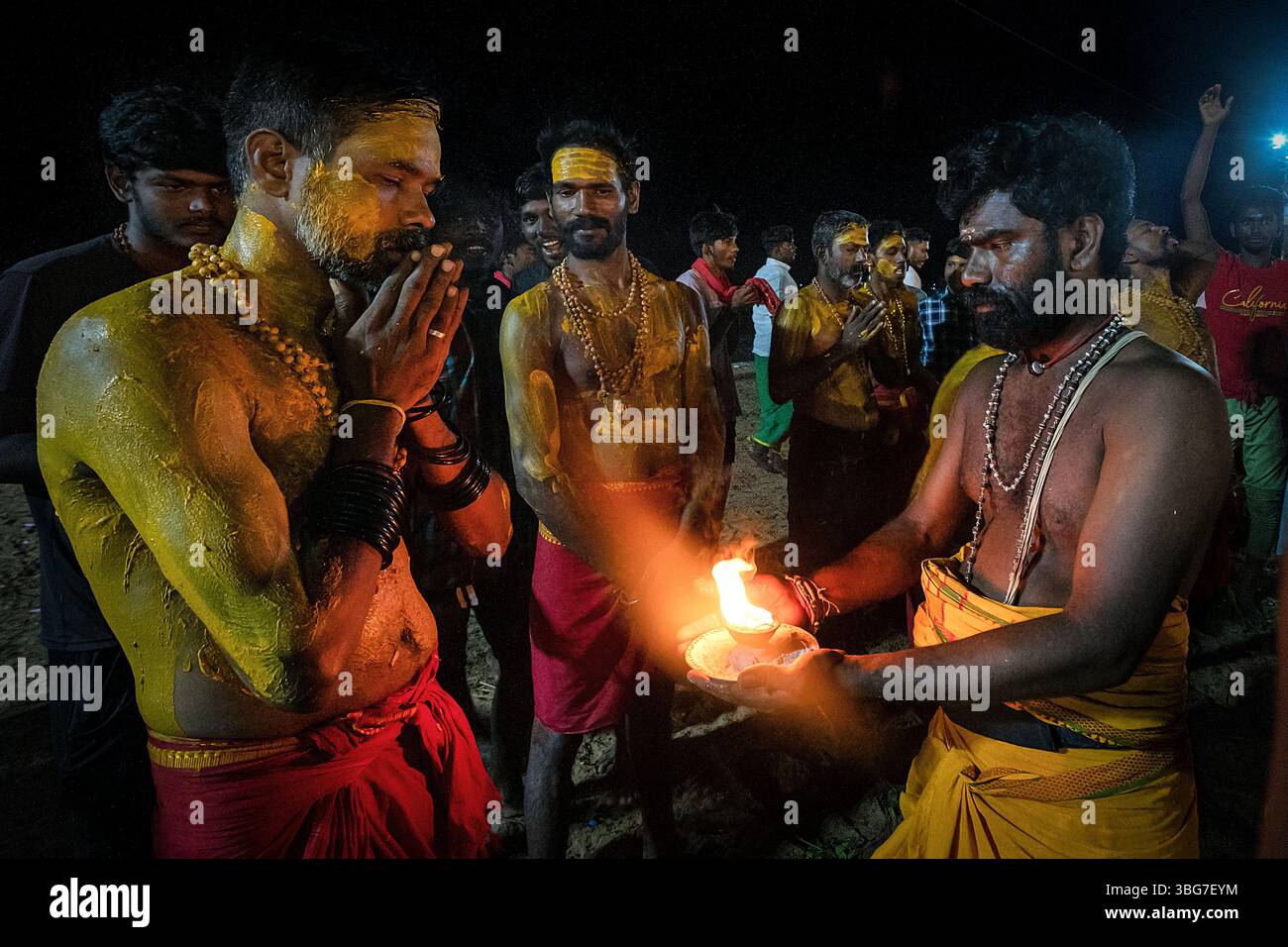 The parade ends in the beach of Kulasai village. The devotees are ...