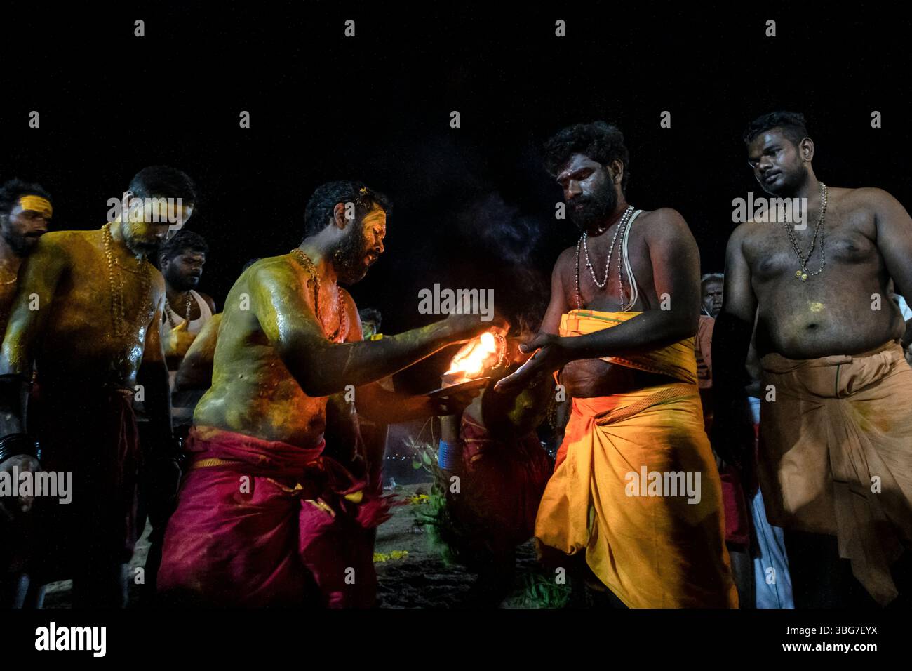 The parade ends in the beach of Kulasai village. The devotees are ...