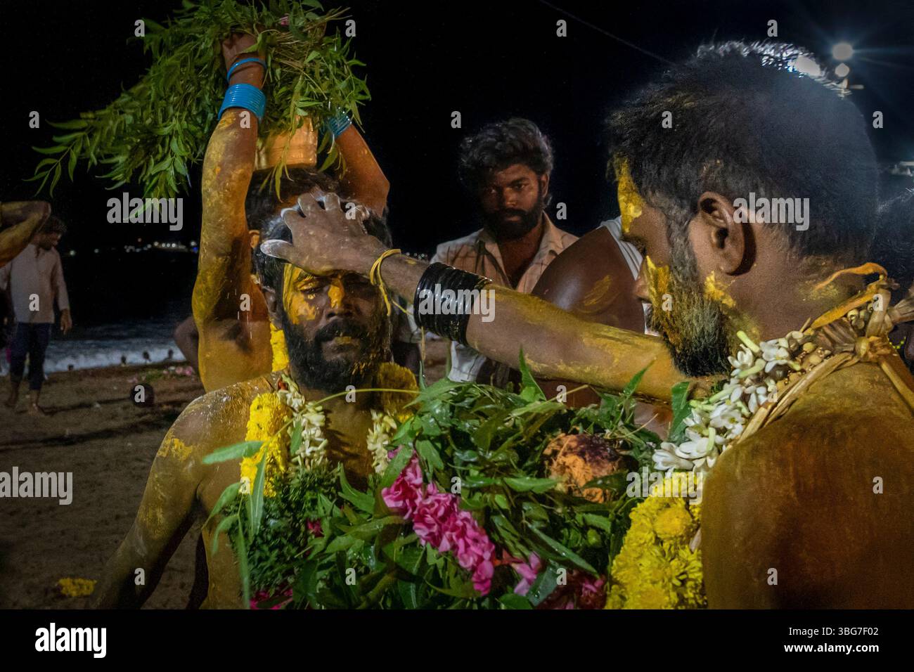 The parade ends in the beach of Kulasai village. The devotees are ...