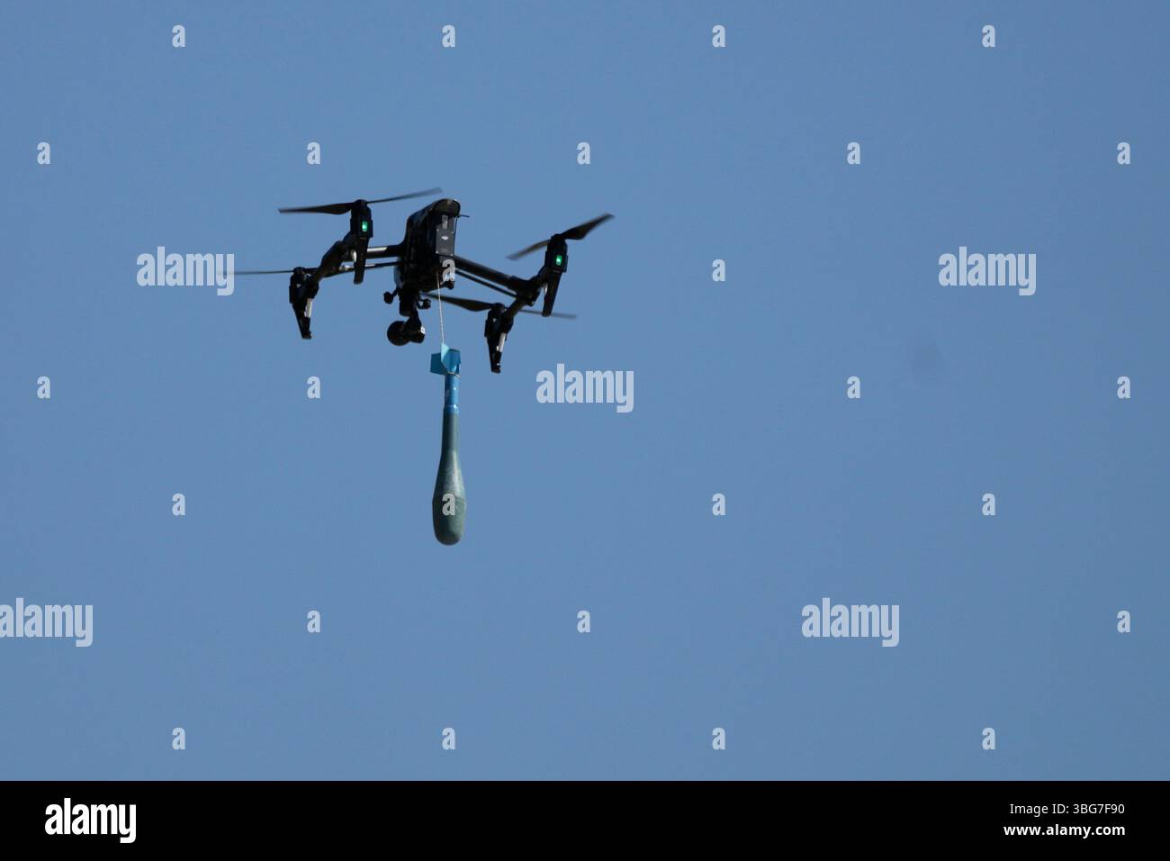 A drone carries a mortar shell as soldiers take part in the U.S.-led ...