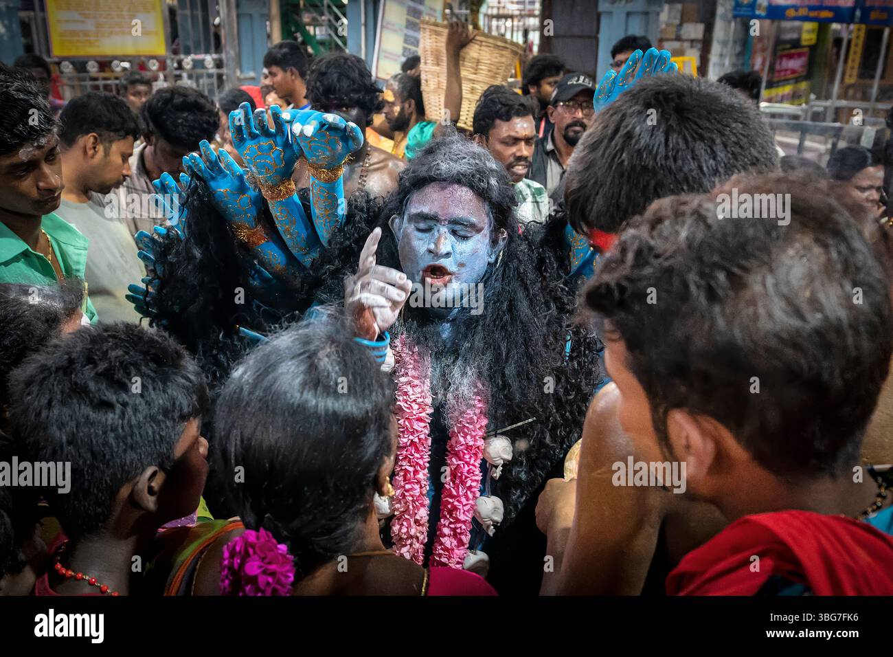 Devotees parade in the Mutharamman temple in Kulasai village, dressed ...