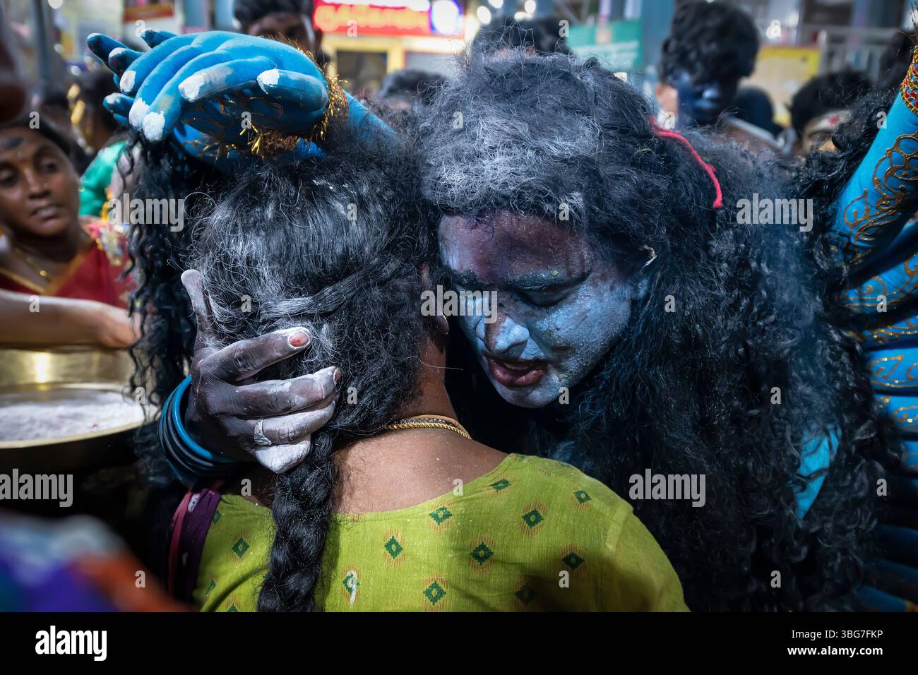 Devotees parade in the Mutharamman temple in Kulasai village, dressed ...
