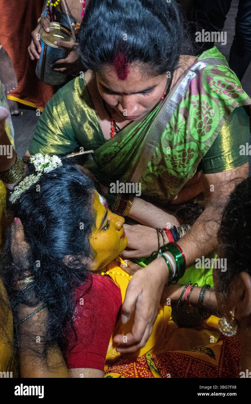 Devotees parade in the Mutharamman temple in Kulasai village, dressed ...