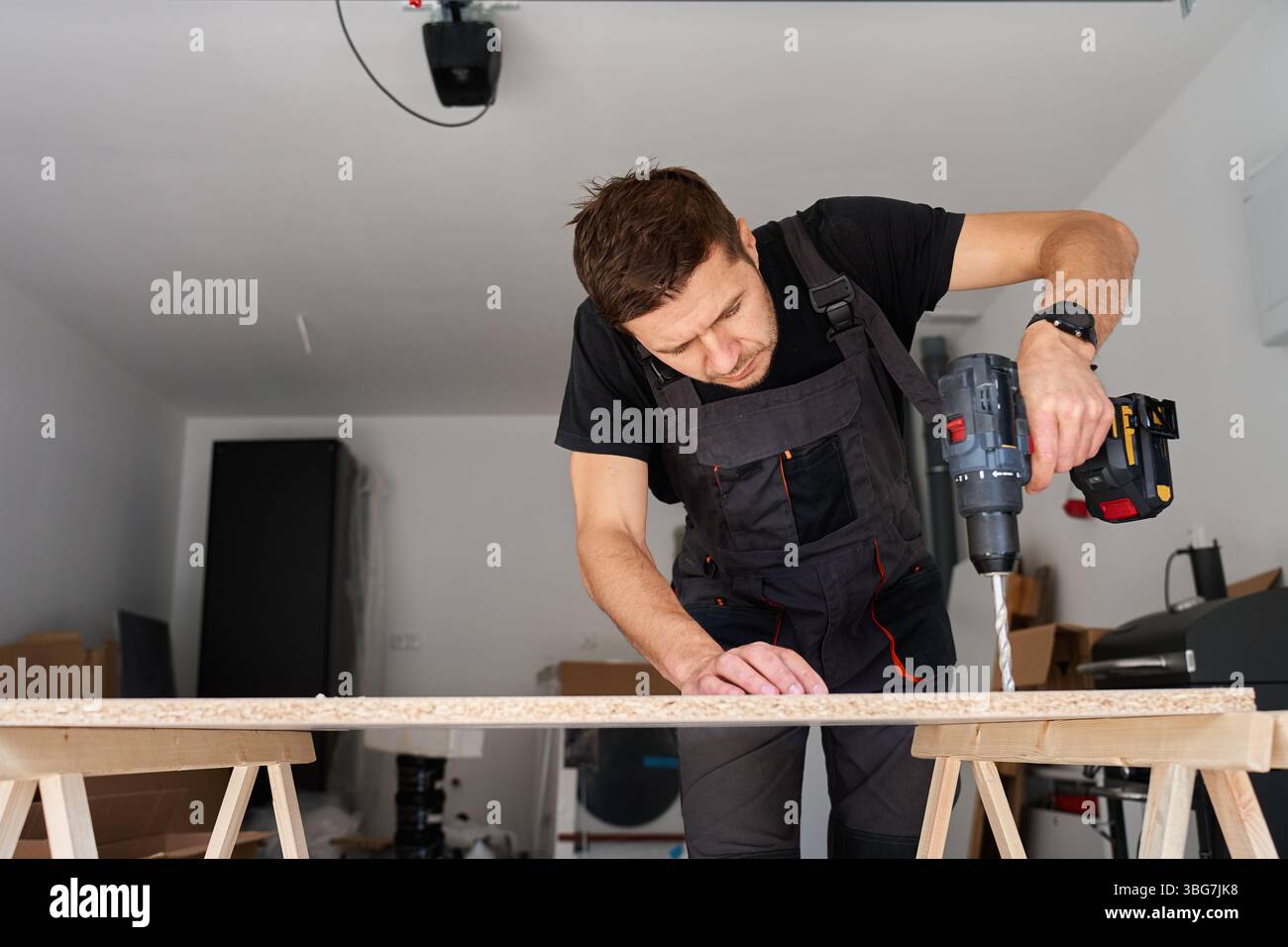 Drilling hole in laminated chipboard hi-res stock photography and ...