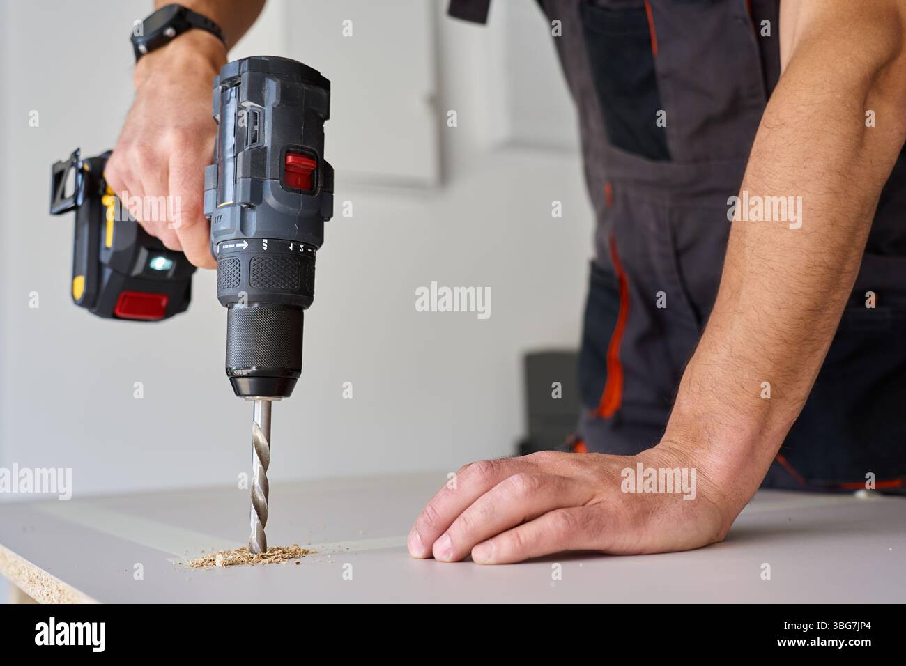 Working drills wooden panel drilling hi-res stock photography and ...