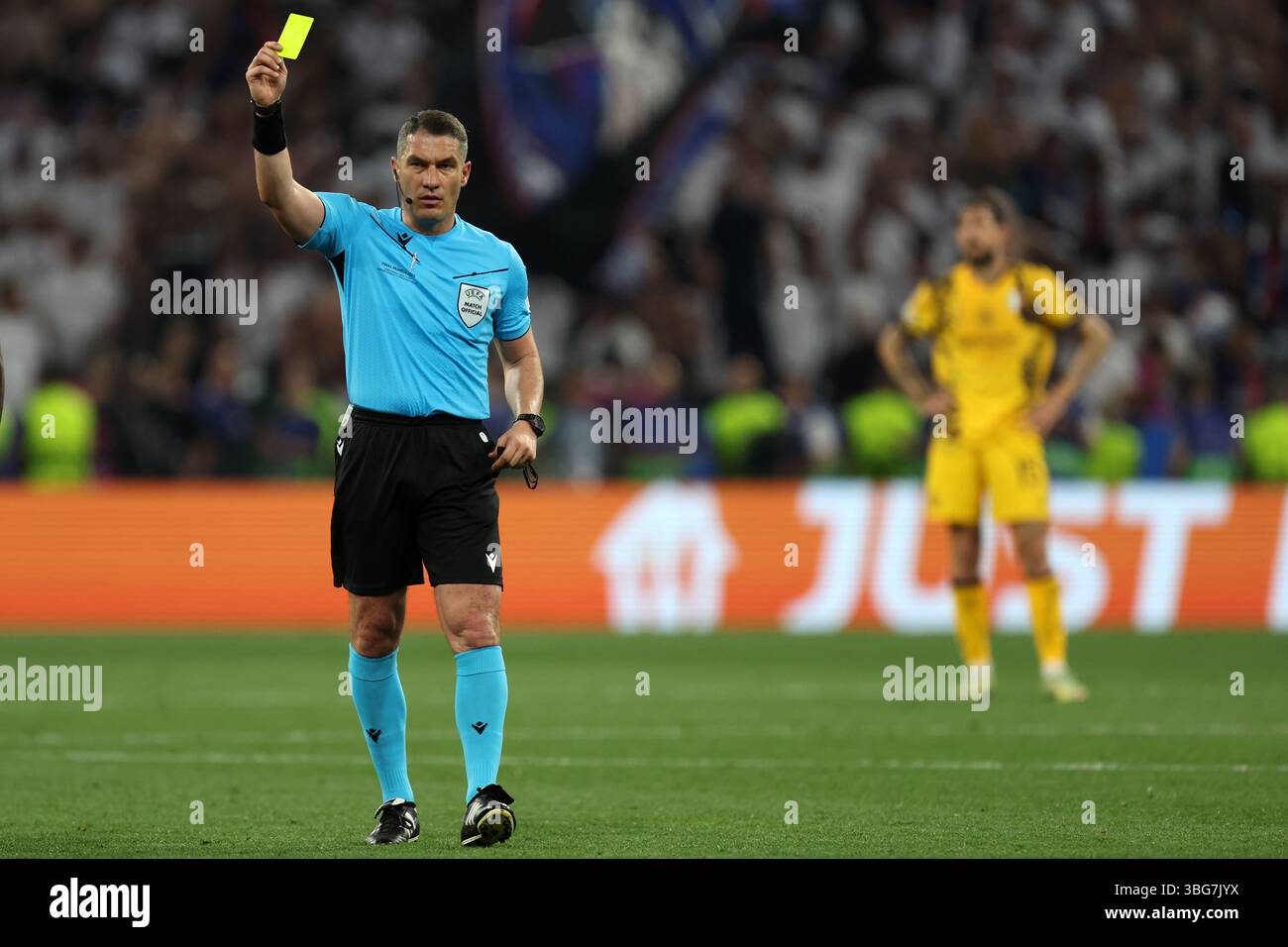 Official referee Istvan Kovacs show a yellow card during the UEFA Champions League Final 2025 ...