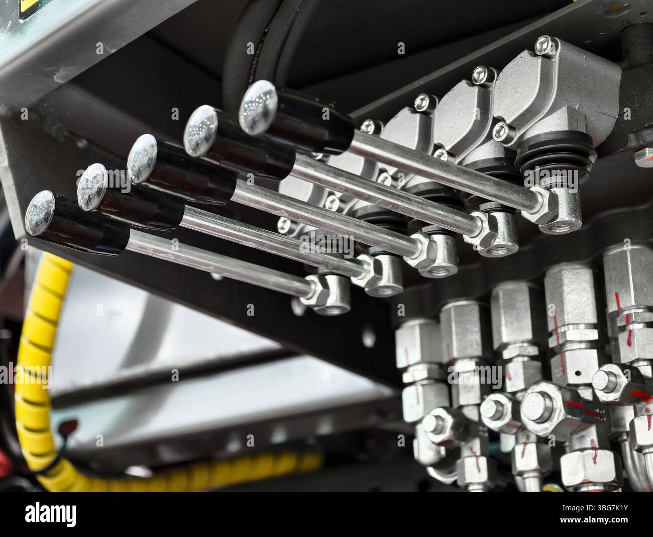 Detailed view of hydraulic levers and connections reveals the ...