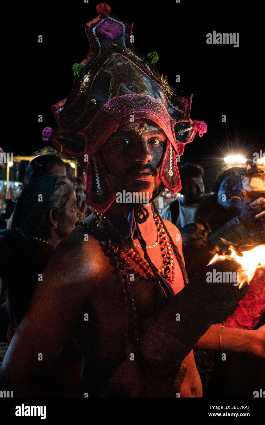 The parade ends in the beach of Kulasai village. The devotees are ...