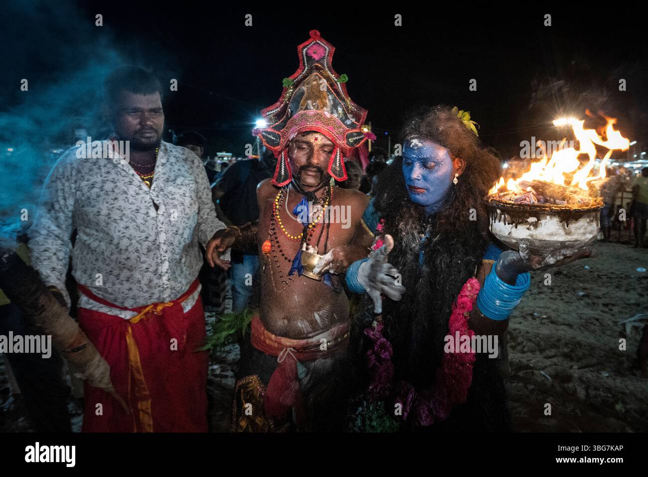 The parade ends in the beach of Kulasai village. The devotees are ...