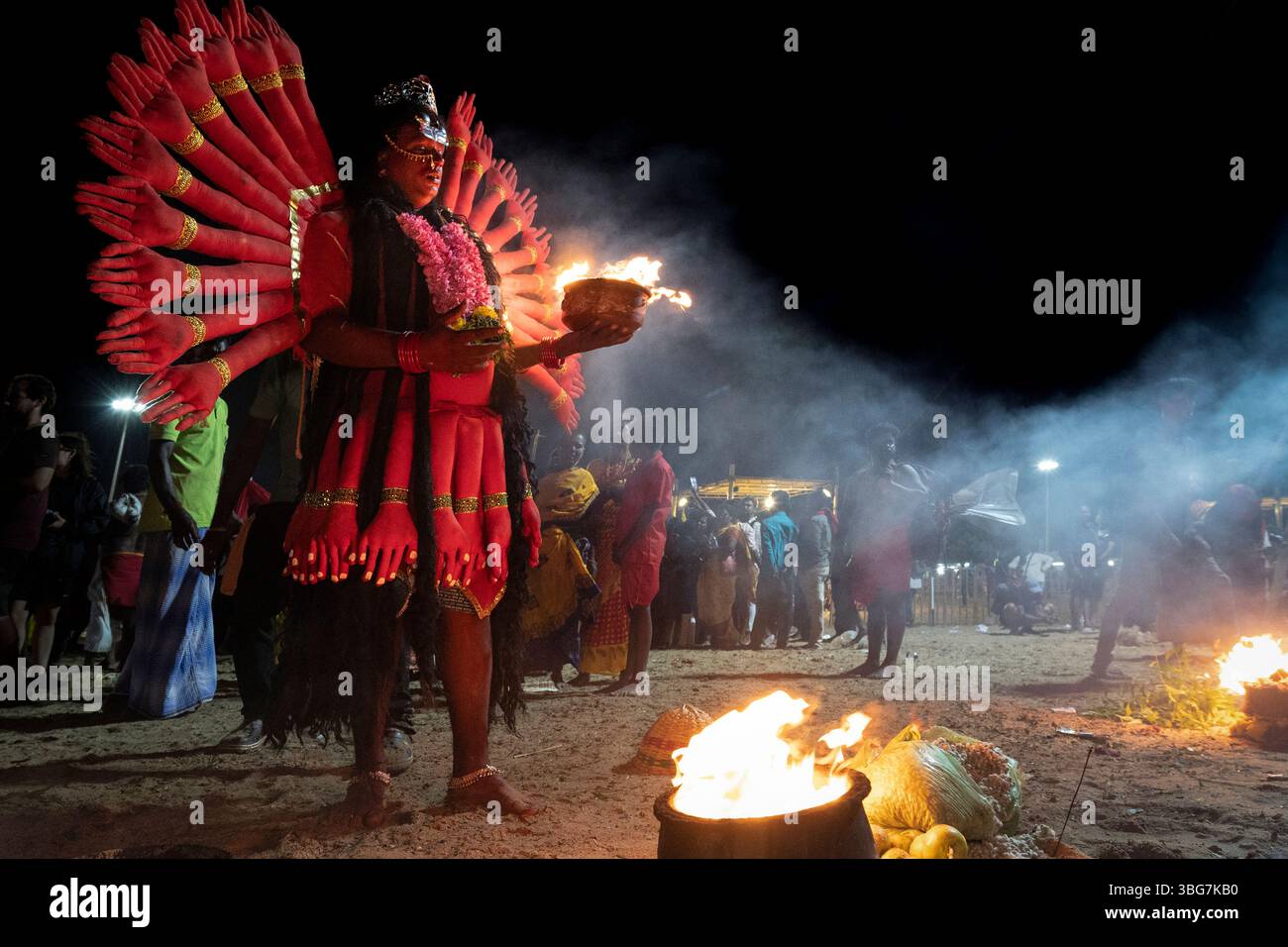 The parade ends in the beach of Kulasai village. The devotees are ...