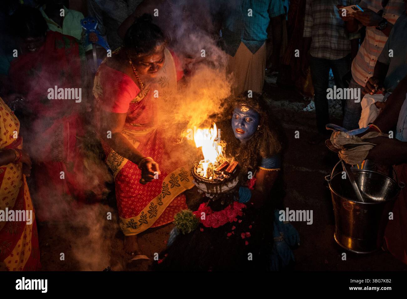 The parade ends in the beach of Kulasai village. The devotees are ...